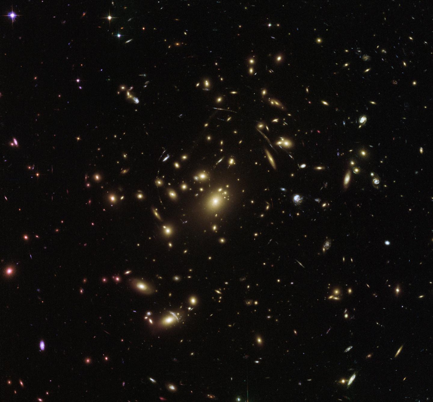 Hubble Sees Galaxy Cluster Warping Space and | EurekAlert!