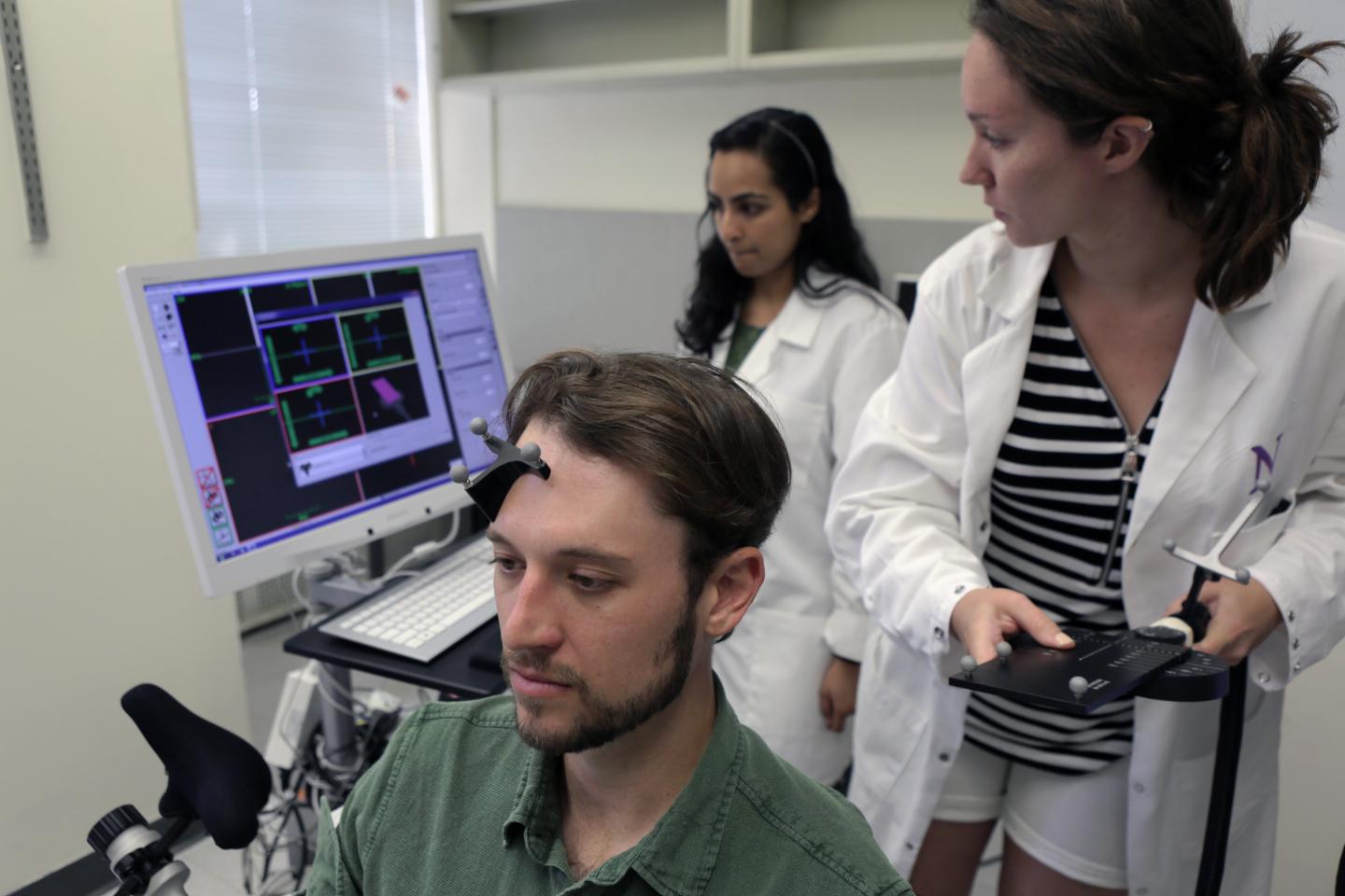 Lab Members Administer Stimula [IMAGE] | EurekAlert! Science News Releases