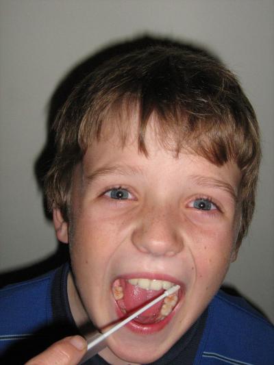 Boy Uses Cheek Swab [IMAGE] | EurekAlert! Science News Releases