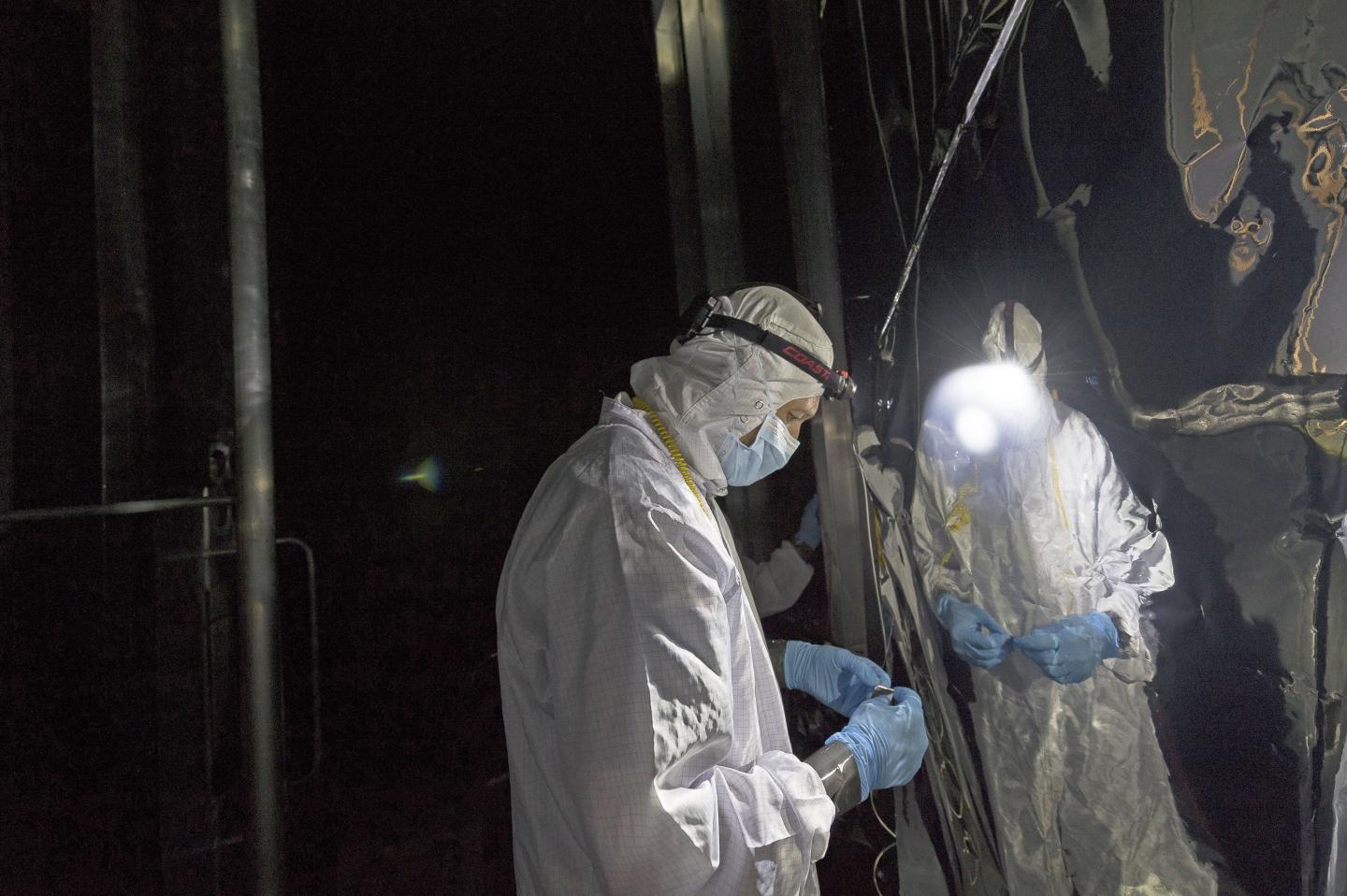 Technician Checks Helium Shrou [IMAGE] | EurekAlert! Science News Releases