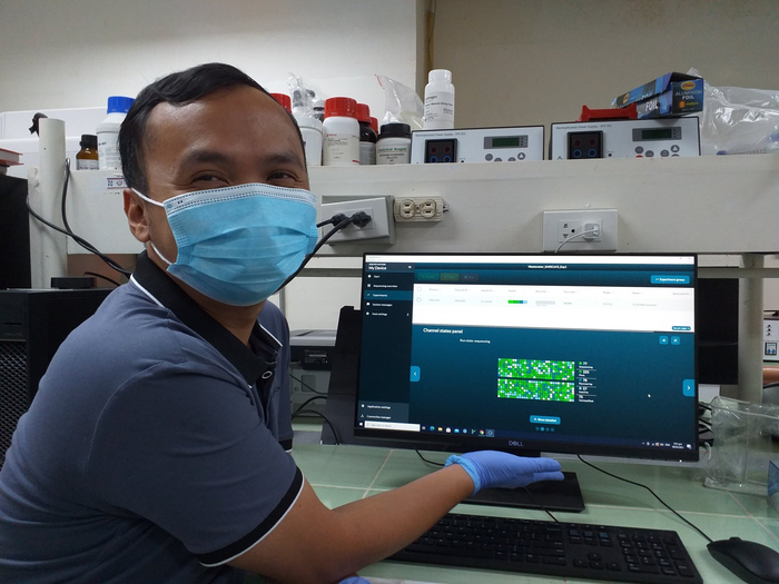 Working with the portable geno [IMAGE] | EurekAlert! Science News Releases