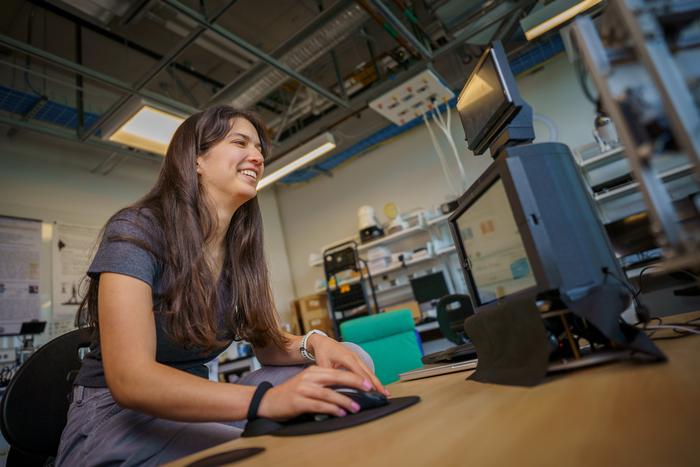 Student interacting with robot [IMAGE] | EurekAlert! Science News Releases