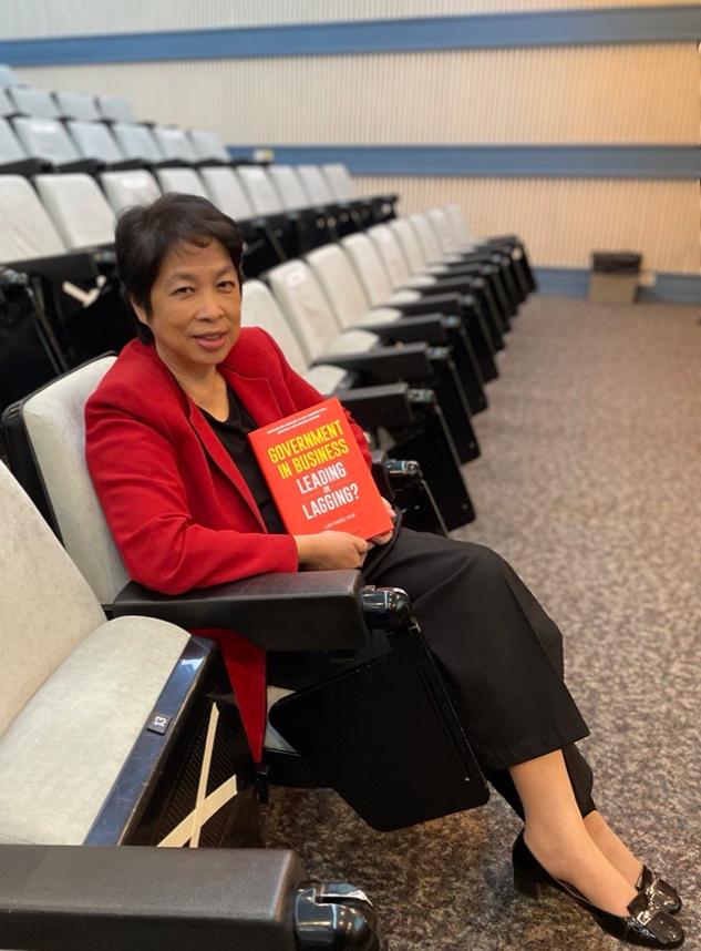 Hwee Hua Lim holding a copy of [IMAGE] | EurekAlert! Science News Releases