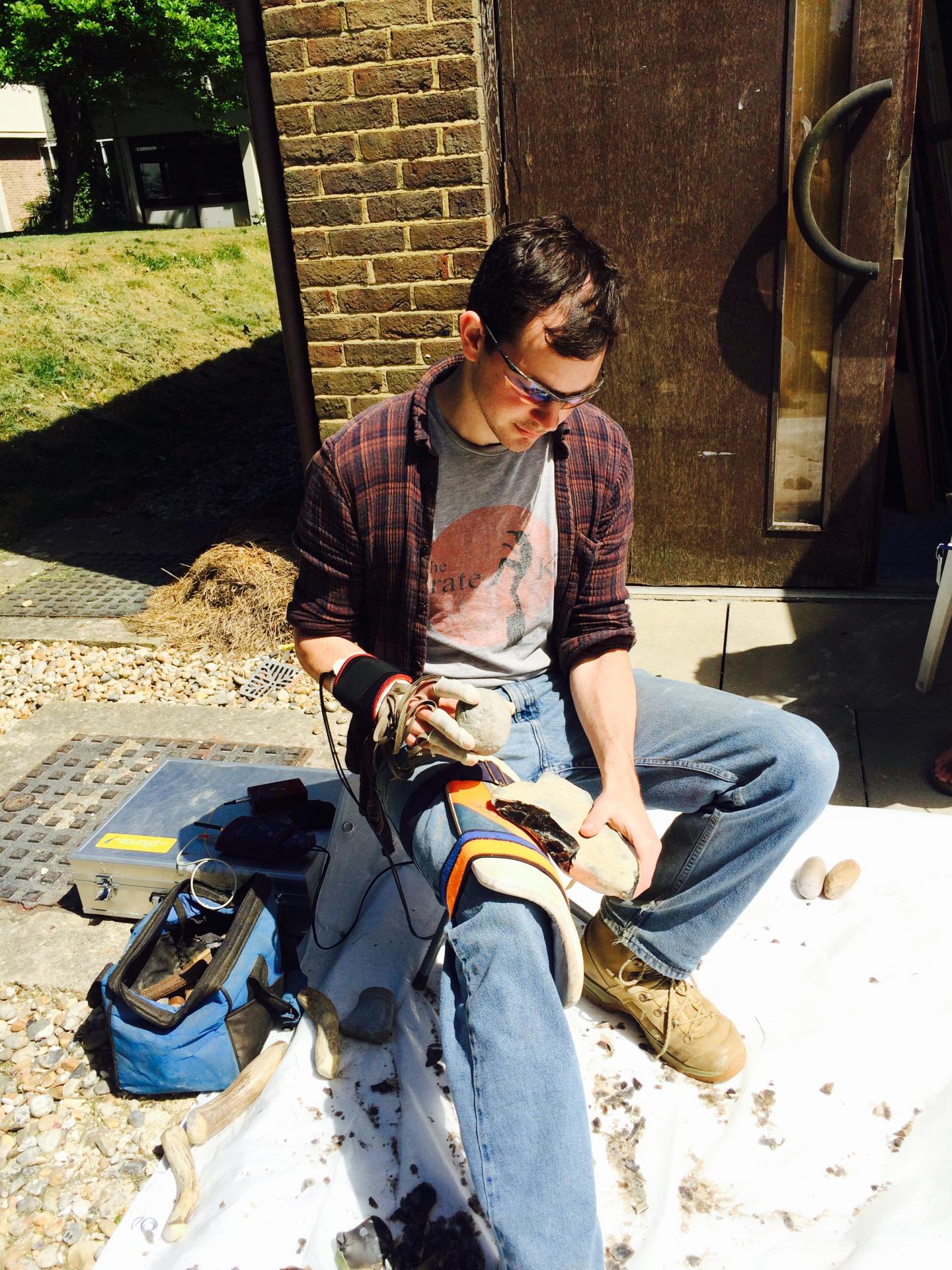 Student Using Stone Tool [IMAGE] | EurekAlert! Science News Releases