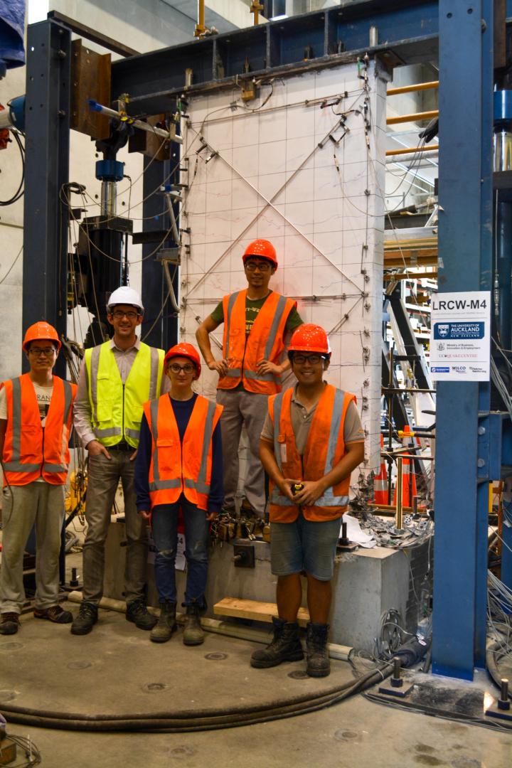 Researchers with Test Wall [IMAGE] | EurekAlert! Science News Releases