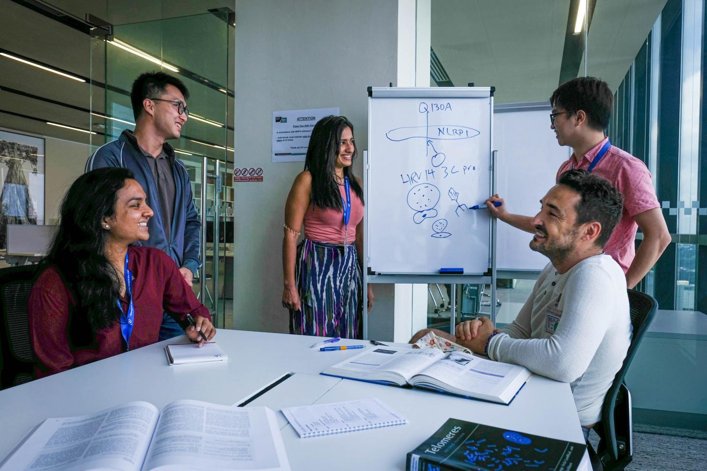 The research team in discussio [IMAGE] | EurekAlert! Science News Releases